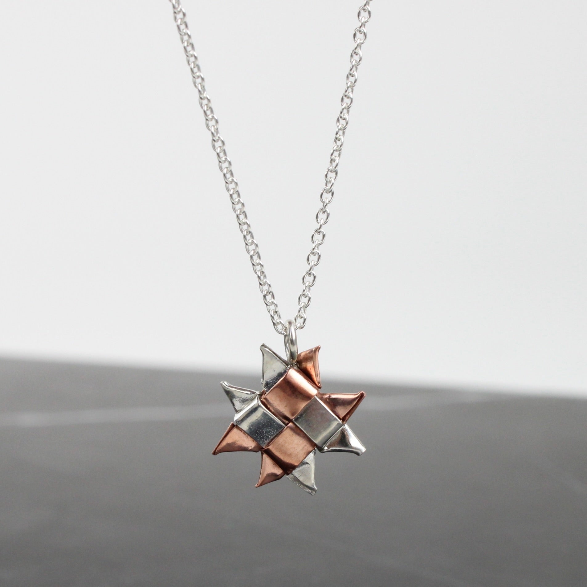 Woven Whetū pendant - copper and silver – Kina NZ Design + Artspace