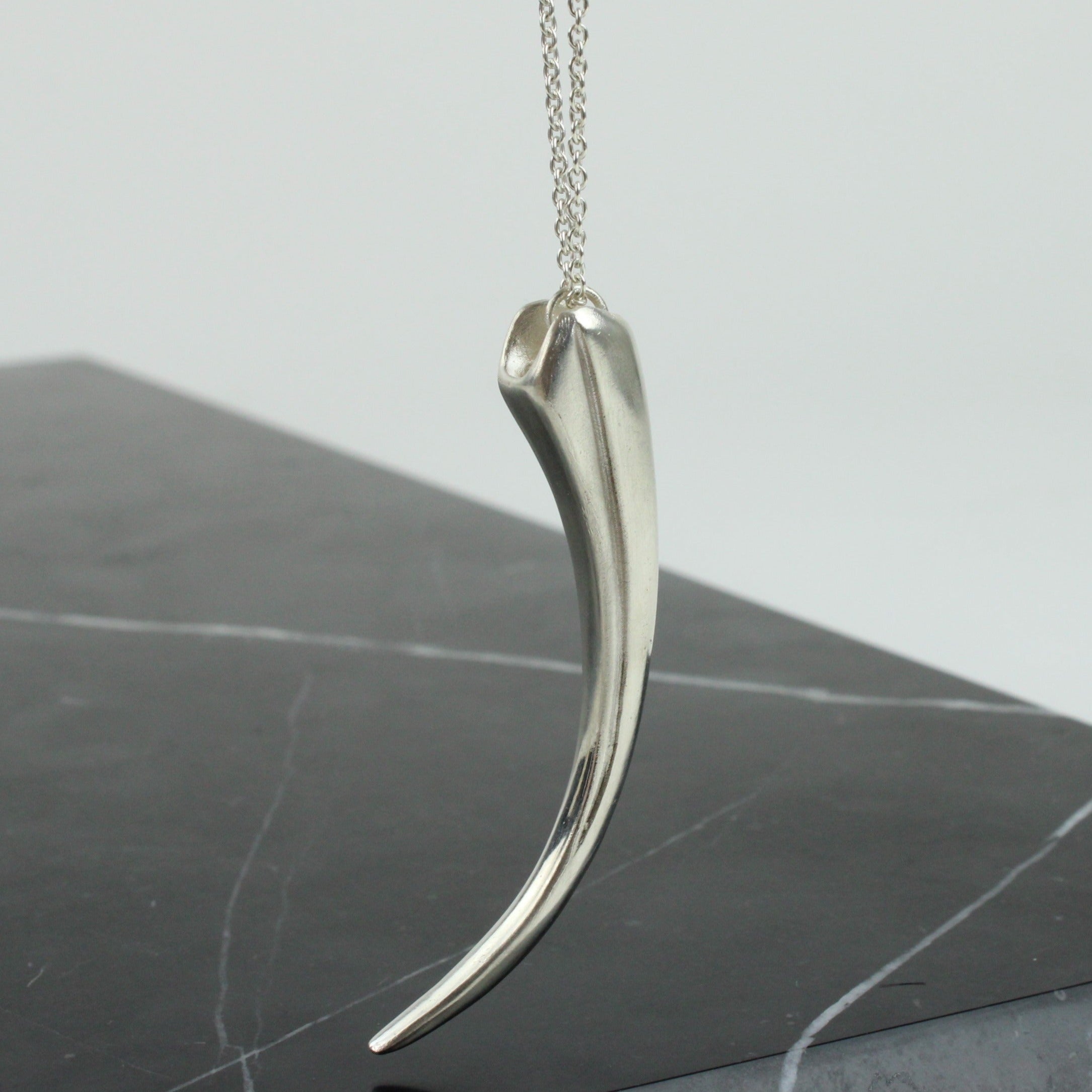 Huia Beak Necklace - long silver – Kina NZ Design + Artspace